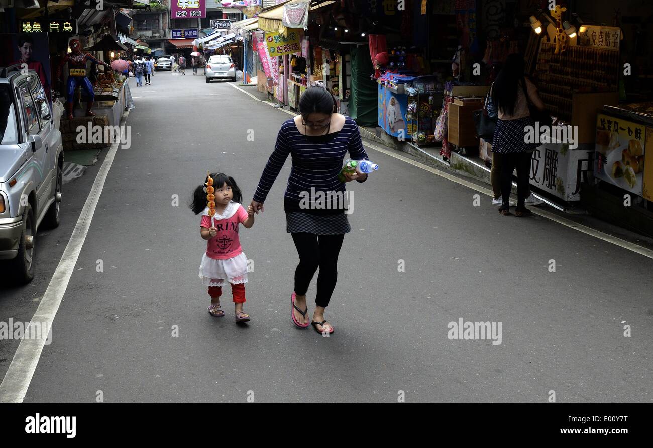 Taipei, China's Taiwan. 28th Apr, 2014. People walk in Neiwan Old ...