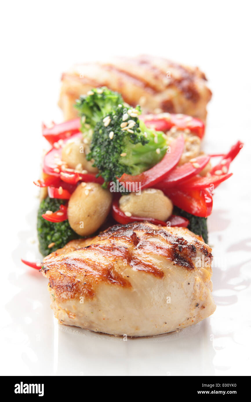 hot roasted chicken with pepper on white background Stock Photo - Alamy