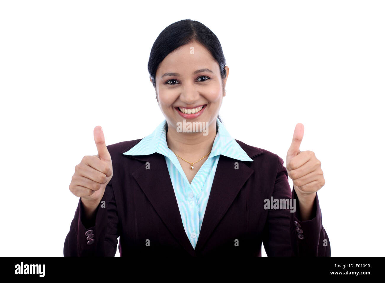 Young Indian business woman with thumbs up gesture against white Stock ...