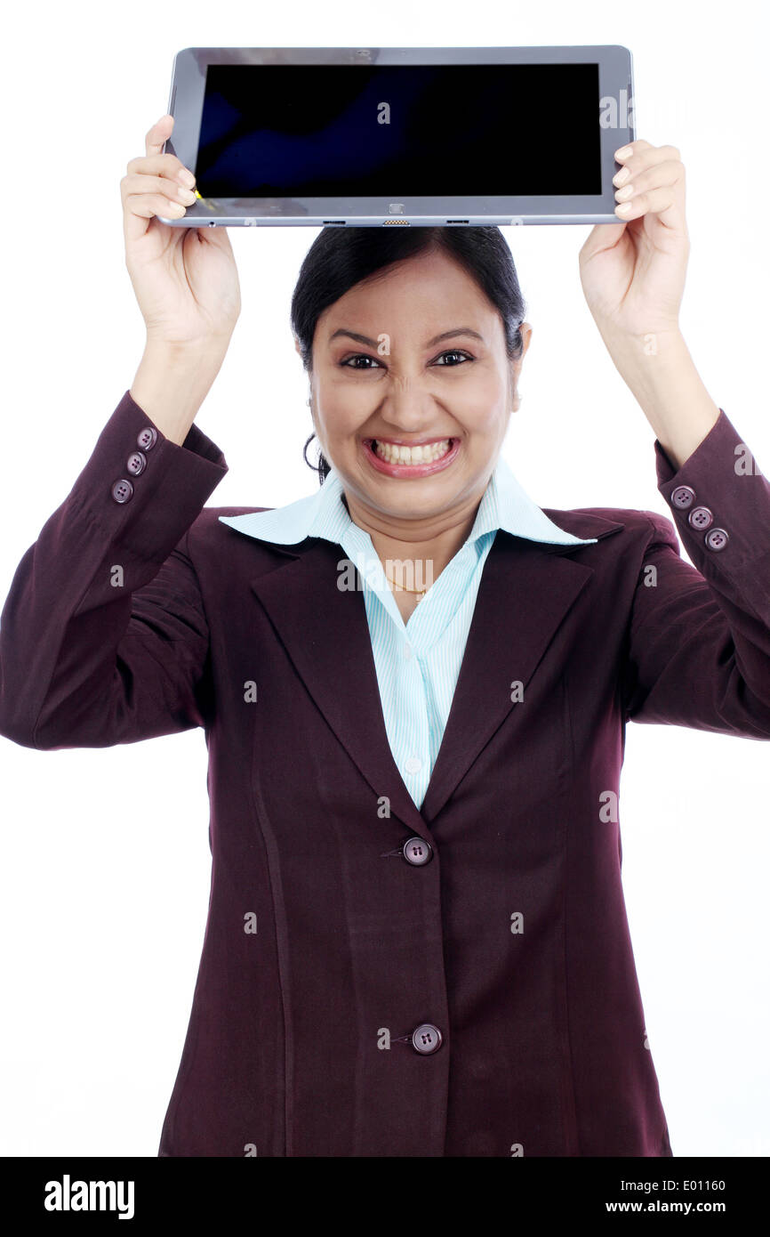 Angry businesswoman throwing her tablet computer Stock Photo - Alamy