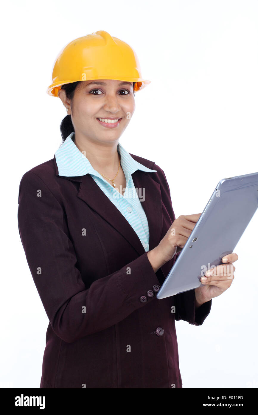Young Indian female engineer with tablet against white background Stock ...