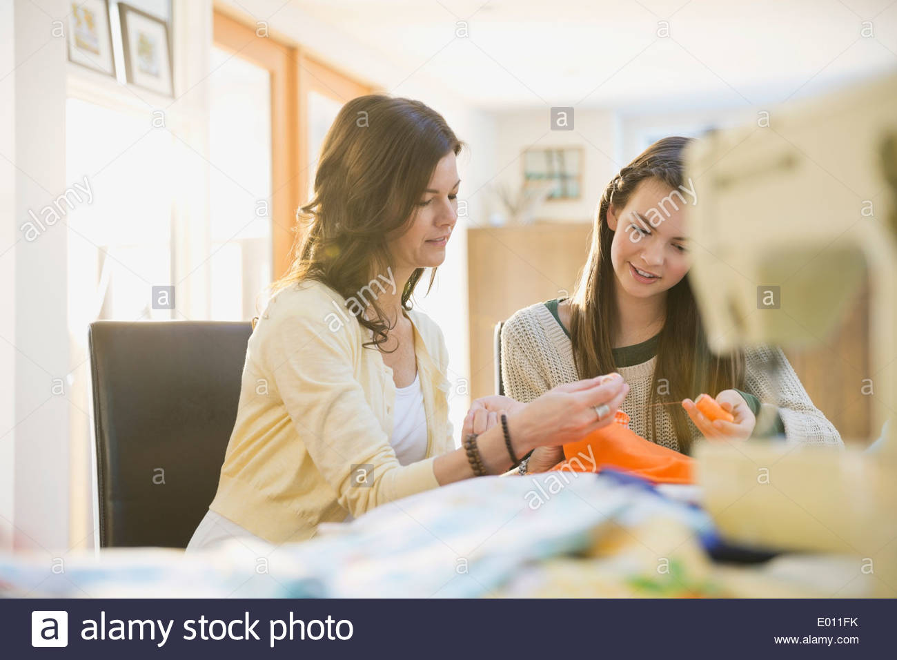 Girls together sewing hi-res stock photography and images - Alamy