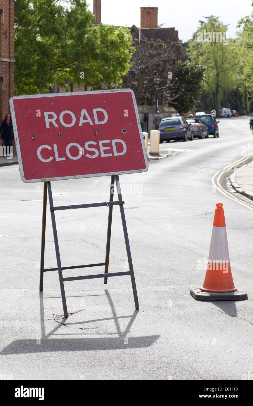 road closed sign and traffic cones causing traffic disruption due to ...