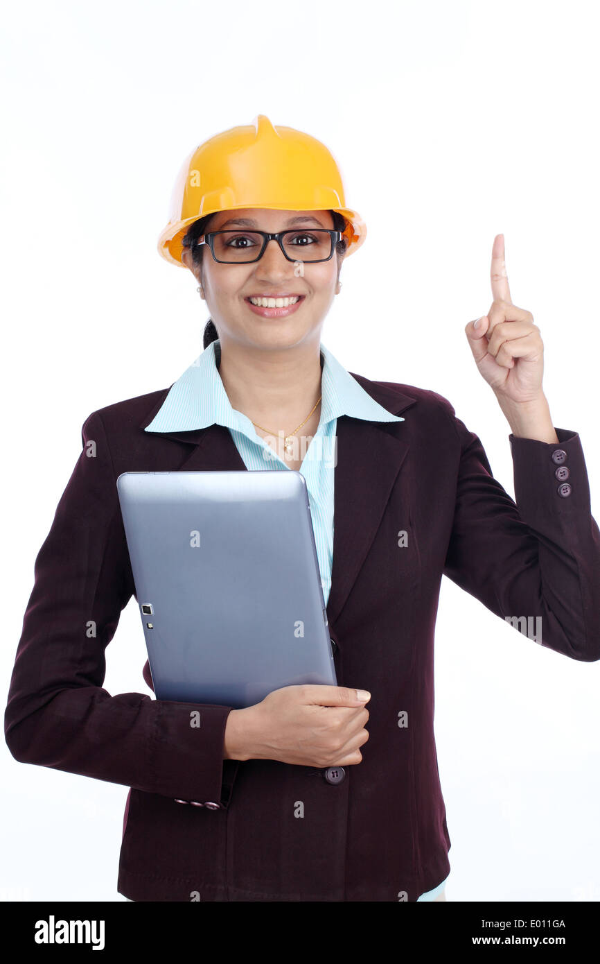 Young Indian female engineer with tablet against white background Stock ...
