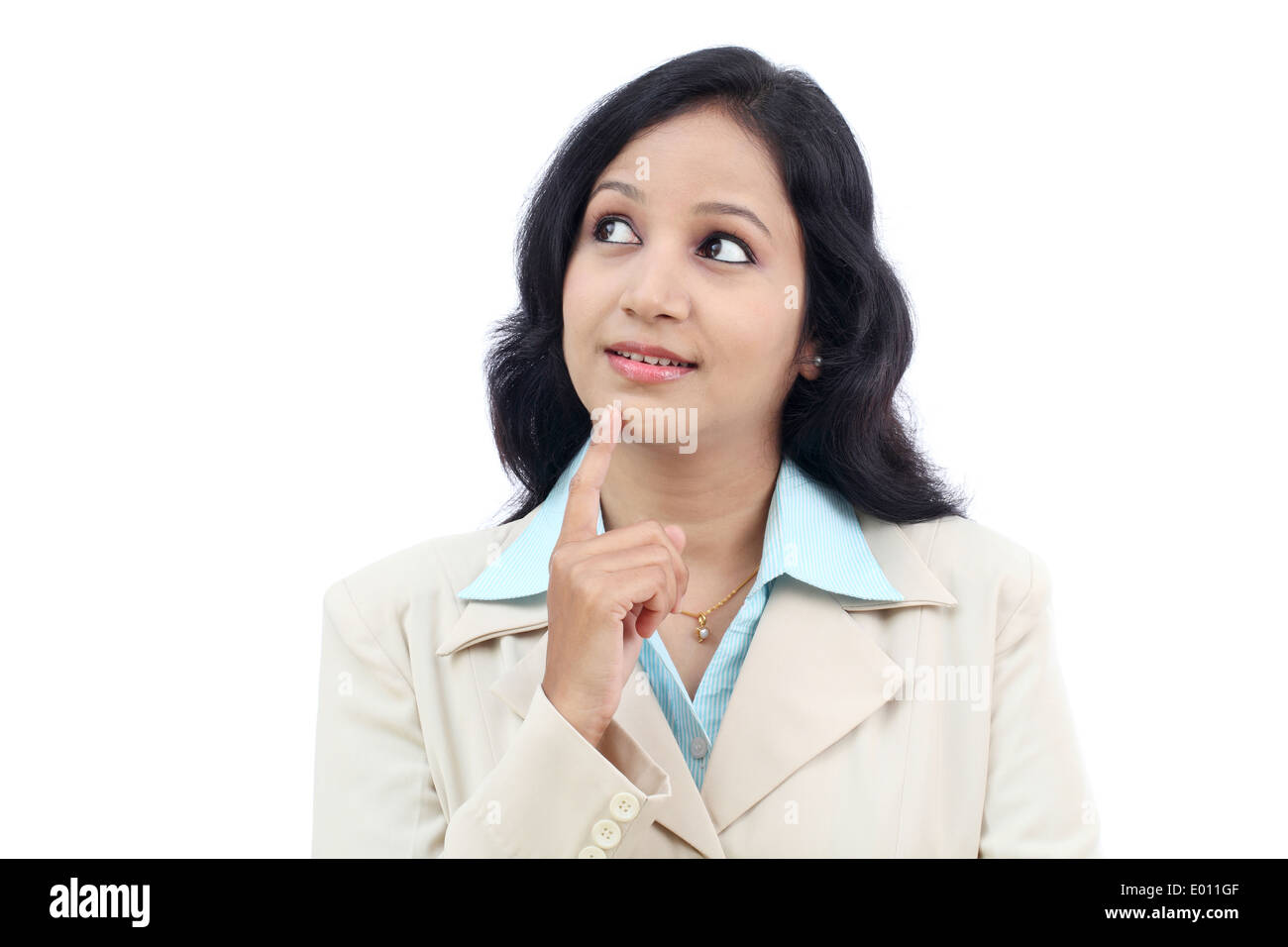 Young business woman thinking against white background Stock Photo - Alamy