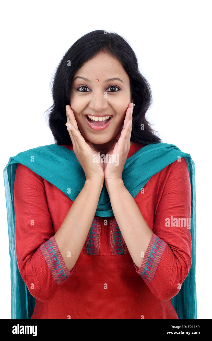 Excited young woman against white background Stock Photo - Alamy