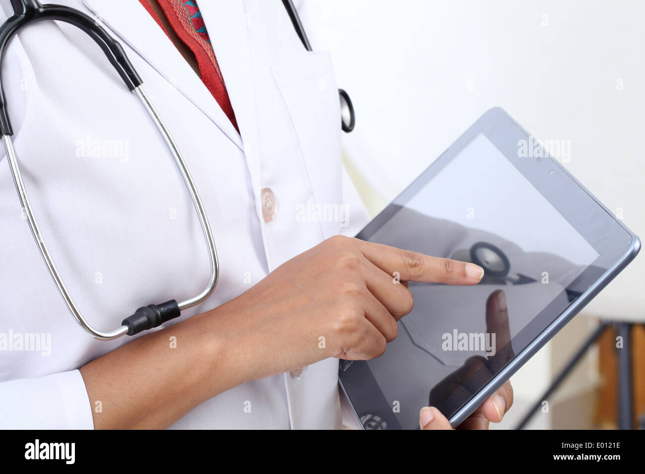 Closeup view of doctor using tablet computer Stock Photo - Alamy