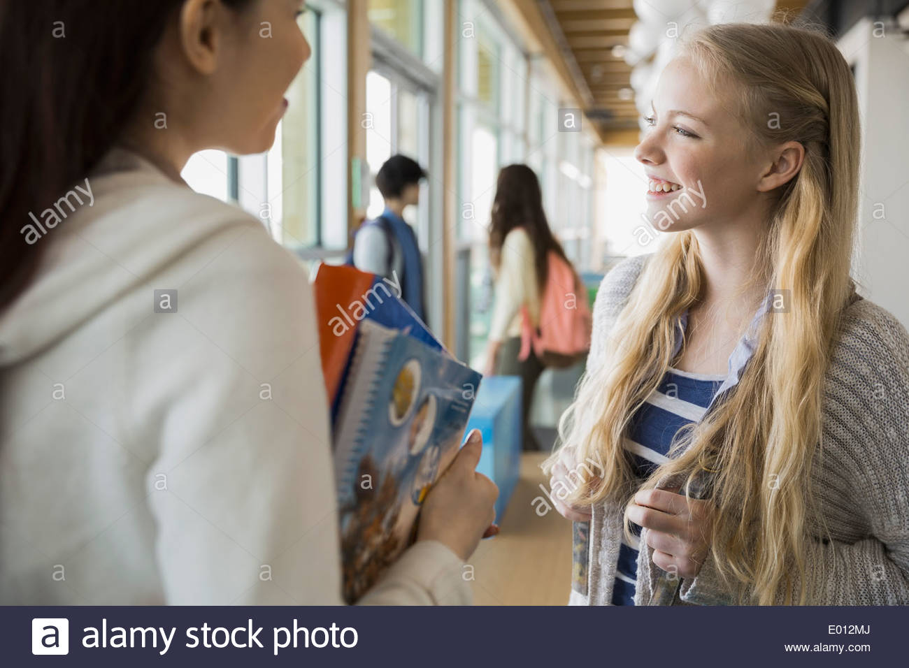 Two people standing close talking hi-res stock photography and images ...