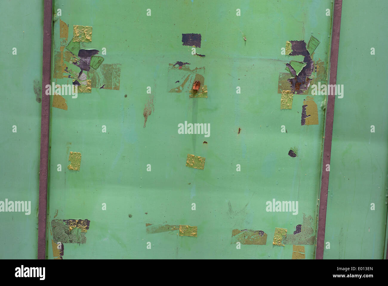 A rustic, industrial green metal wall, old, worn and rusty. Surface has ...