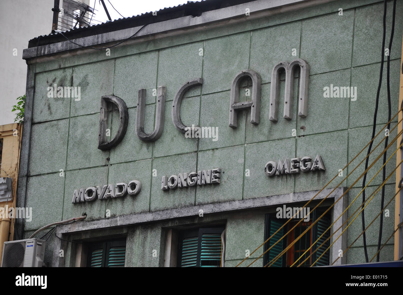 signage on old colonial building in Hanoi, vietnam Stock Photo - Alamy