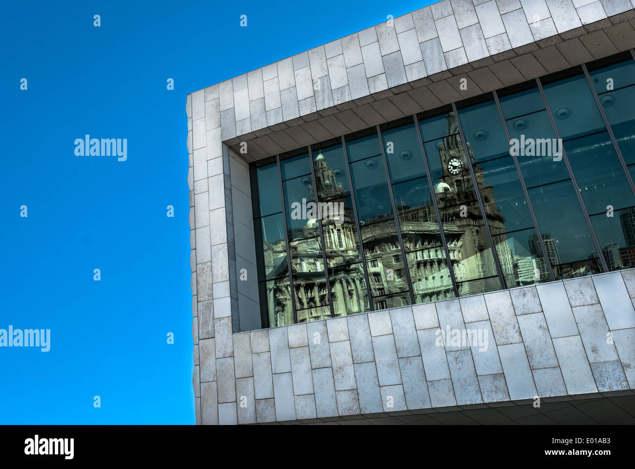 The window of the museum of Liverpool reflecting the Liver Buildings ...