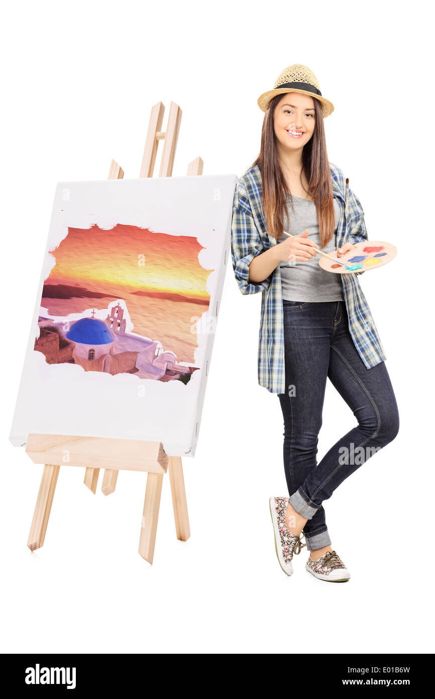 Female artist leaning on an easel with painting Stock Photo - Alamy