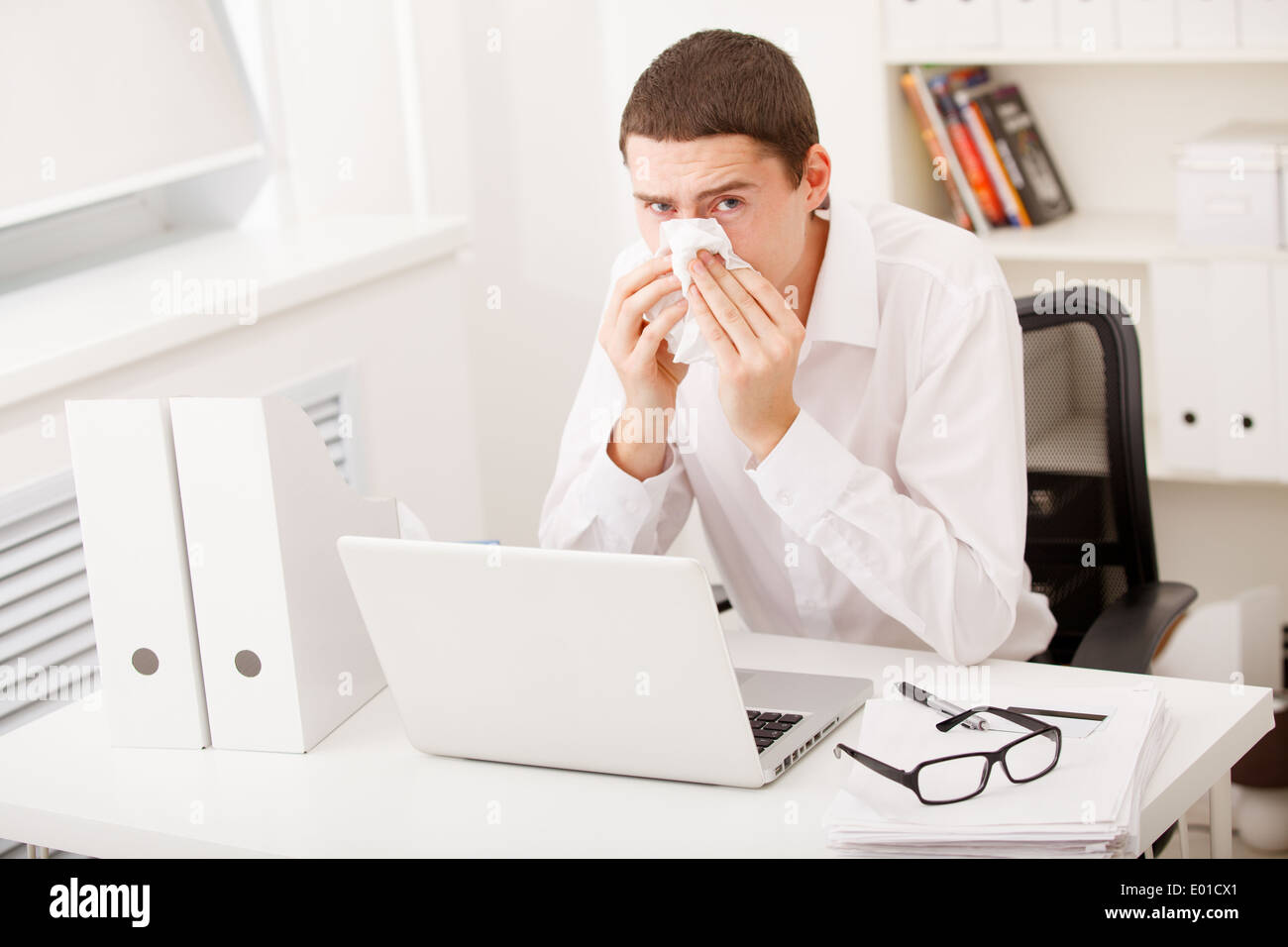 Office worker sneezing hi-res stock photography and images - Alamy