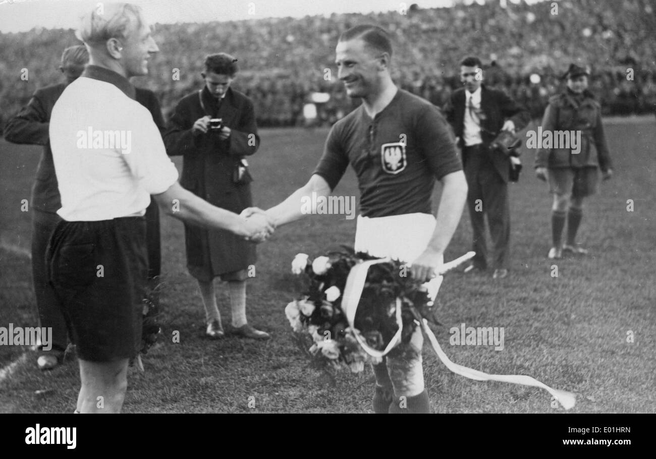 The captains of the Polish and German national team greeting each other ...
