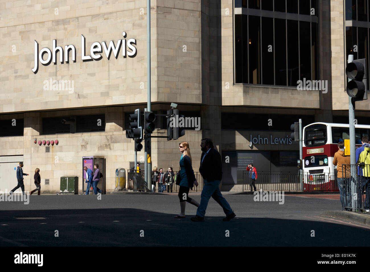 Shoppers crossing the road outside of John Lewis department store at St ...