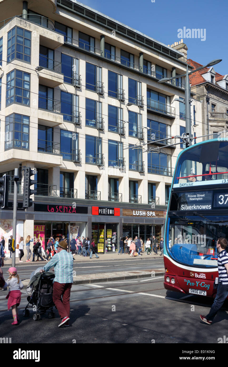 Tourists crossing the road at a junction in Princes Street Edinburgh ...