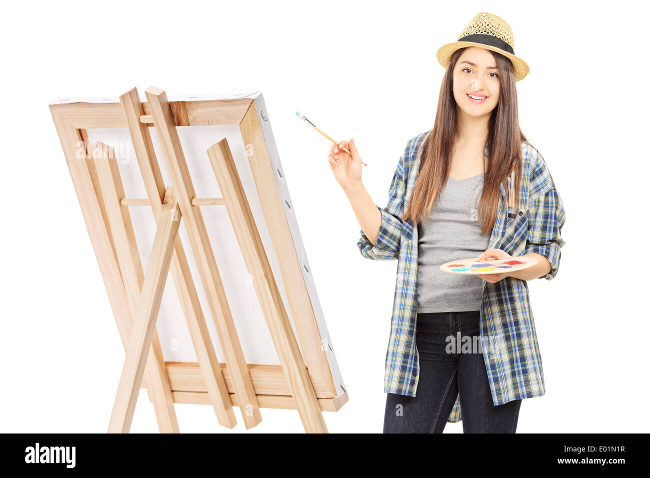 Young female painter drawing on a canvas Stock Photo - Alamy