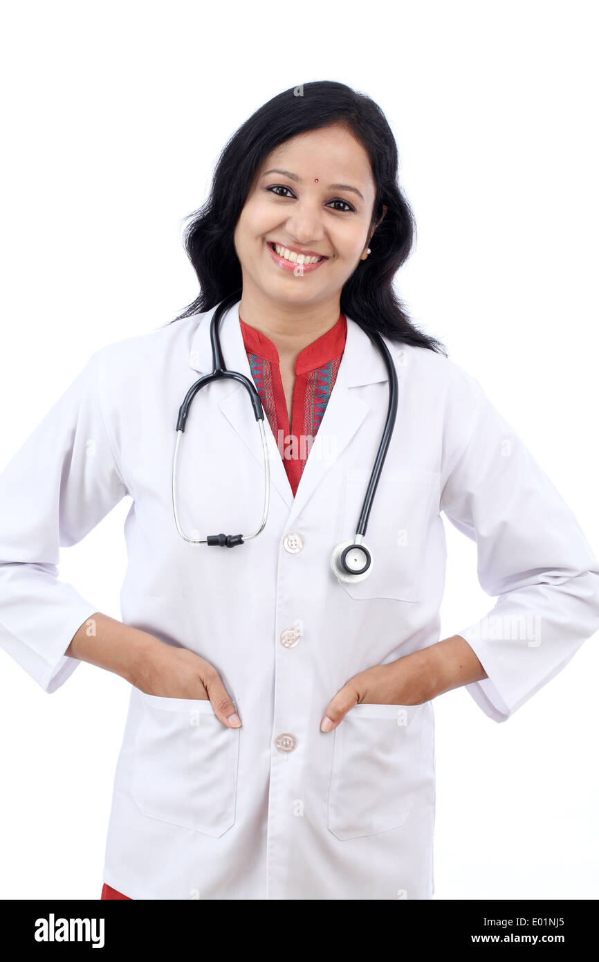 Happy young female doctor against white background Stock Photo - Alamy