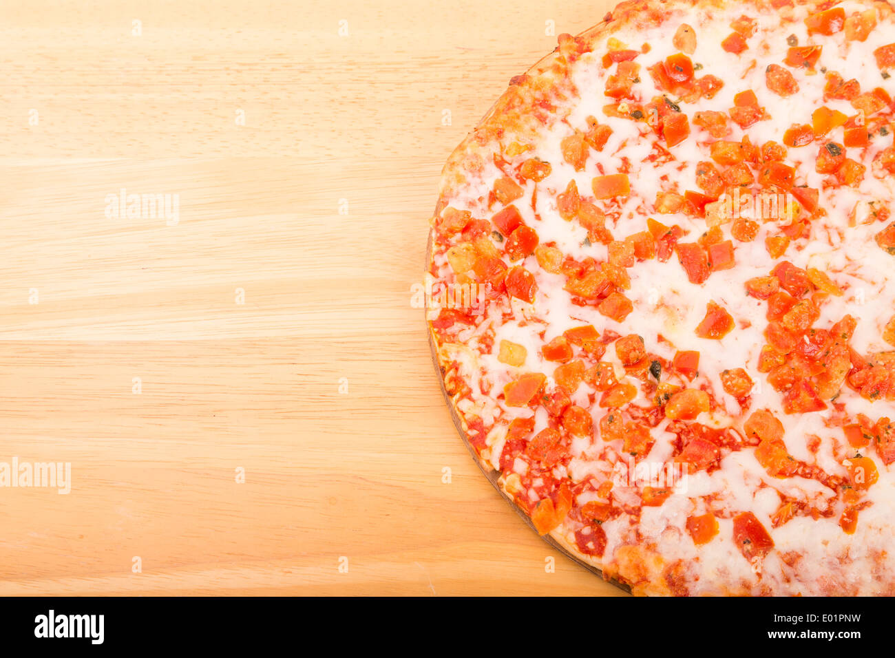 Fresh, hot pizza on a wood table Stock Photo - Alamy