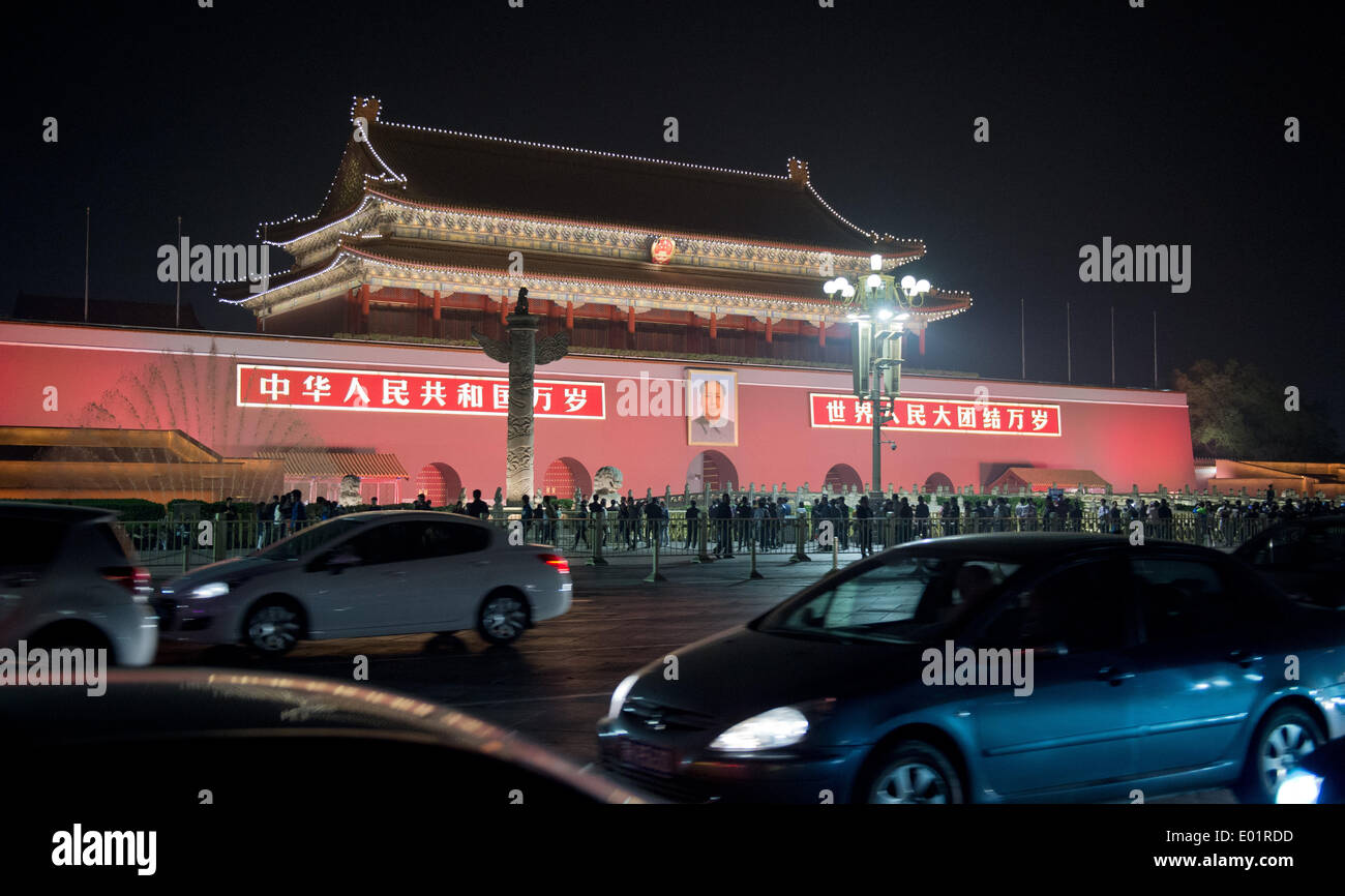 Bejing, China. 13th Apr, 2014. Cars pass by the entrance of the ...