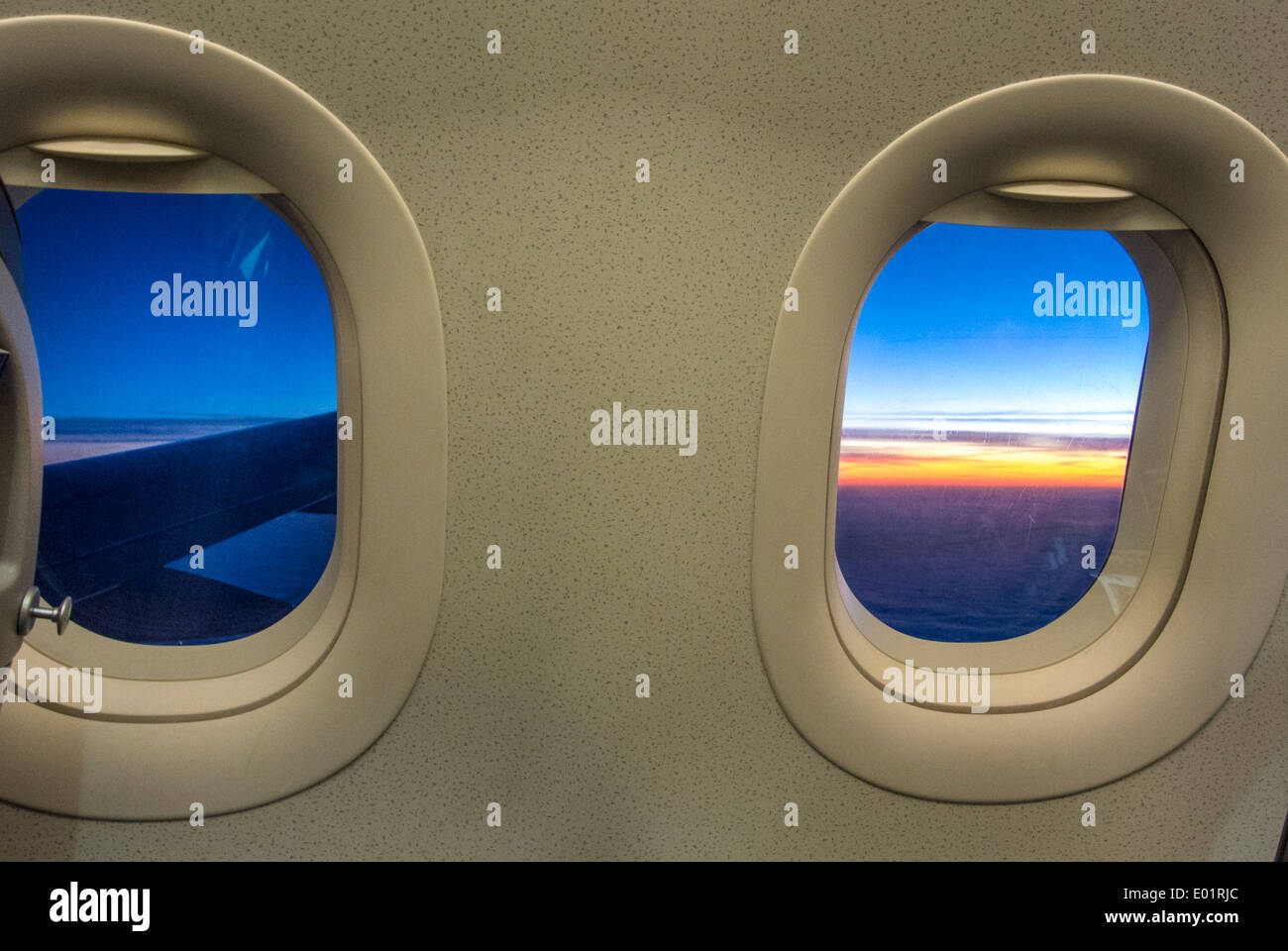 Looking out of an Airbus window at sunset Stock Photo - Alamy