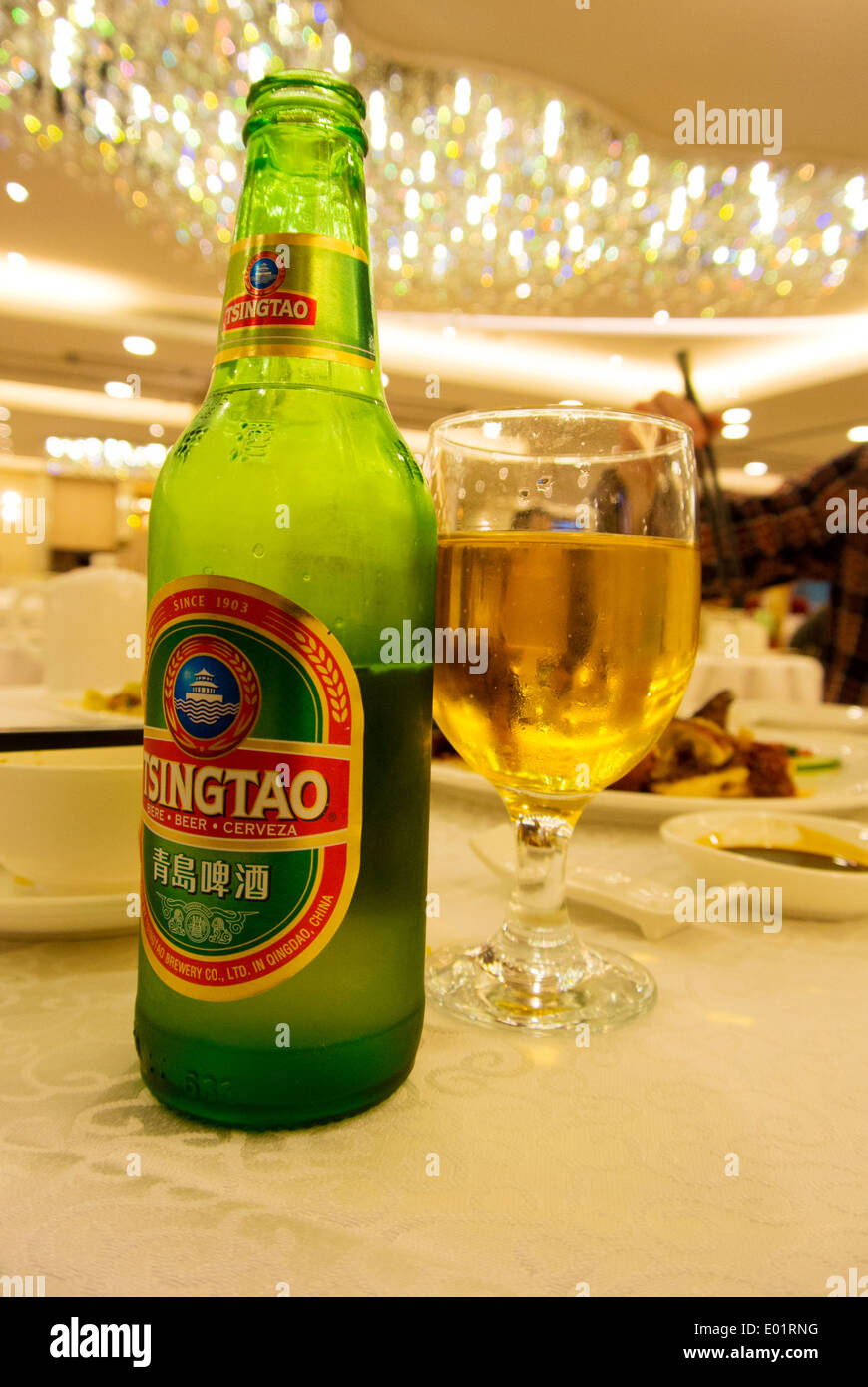 Tsingtao Chinese cold beer bottle and glass Stock Photo - Alamy