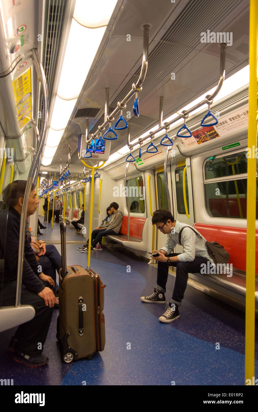 Passengers on Hong Kong MTR metro transport system underground tube ...