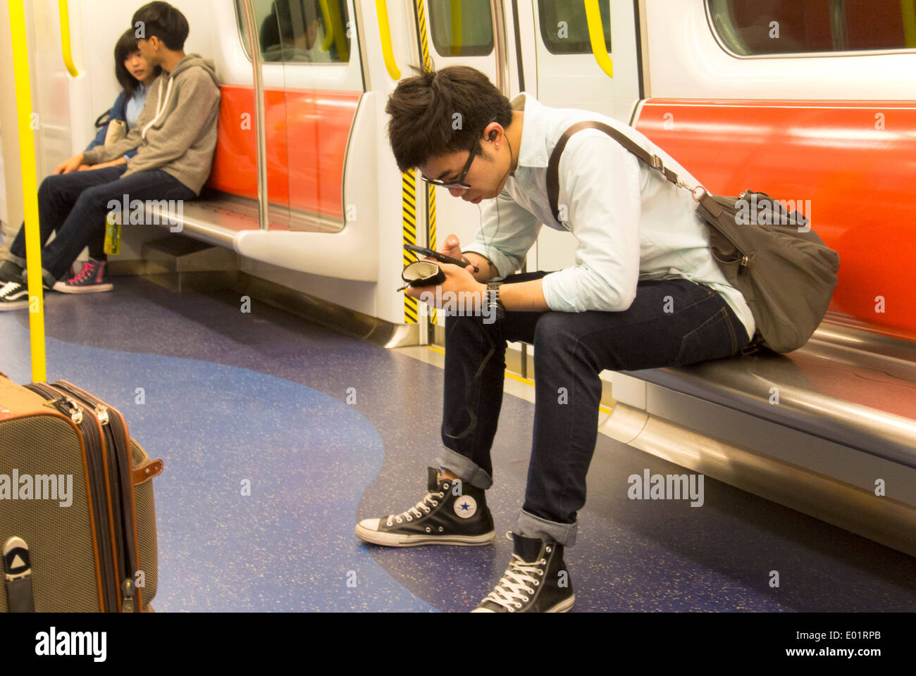 Passengers on Hong Kong MTR metro transport system underground tube ...