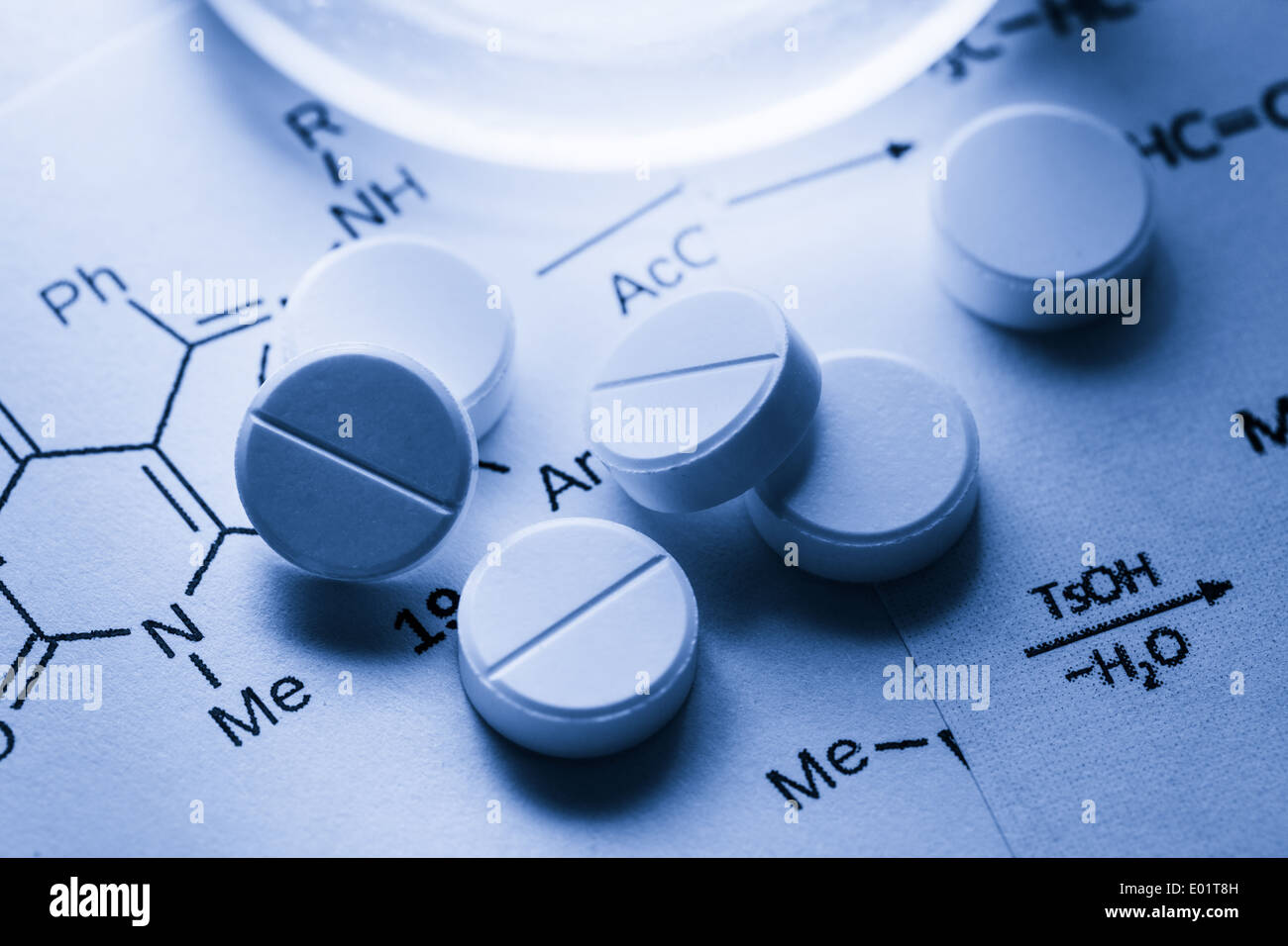 Chemistry reaction formula with white pills Stock Photo - Alamy
