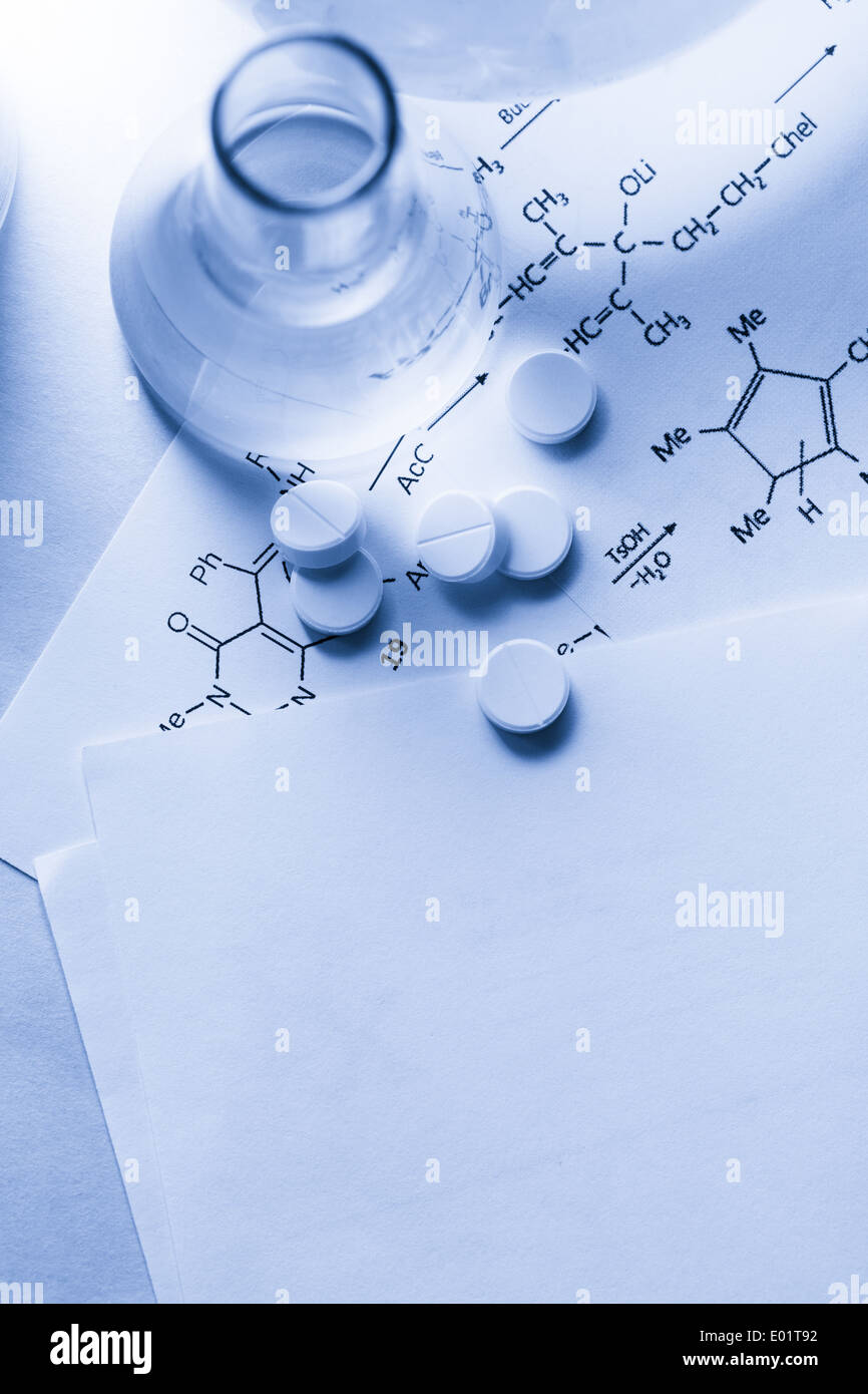 Chemistry reaction formula with white pills Stock Photo - Alamy