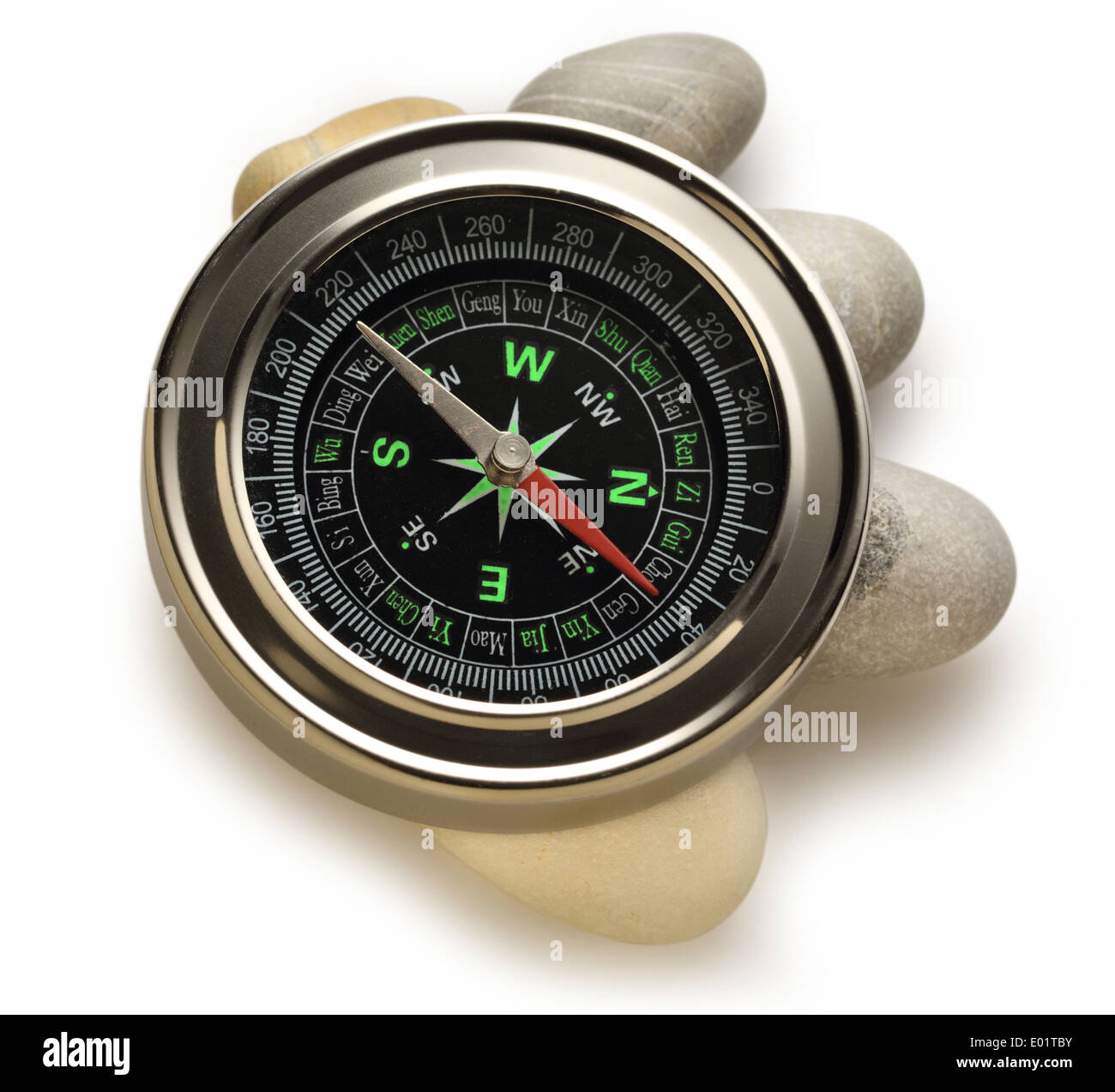 Compass and sea stones on white Stock Photo - Alamy