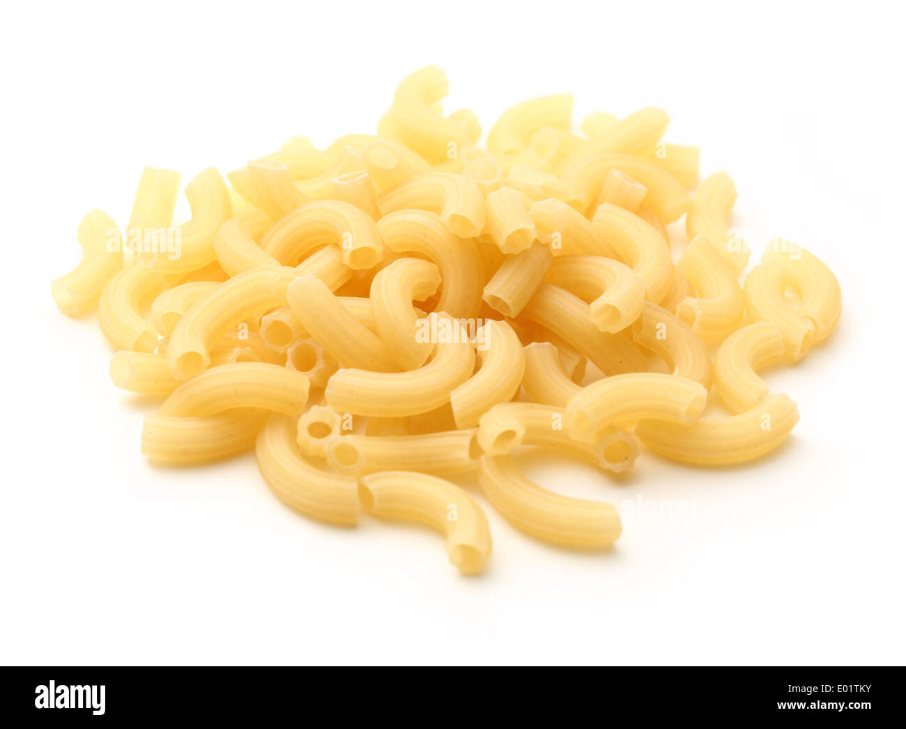 Short ribbed pasta tubes on white Stock Photo - Alamy