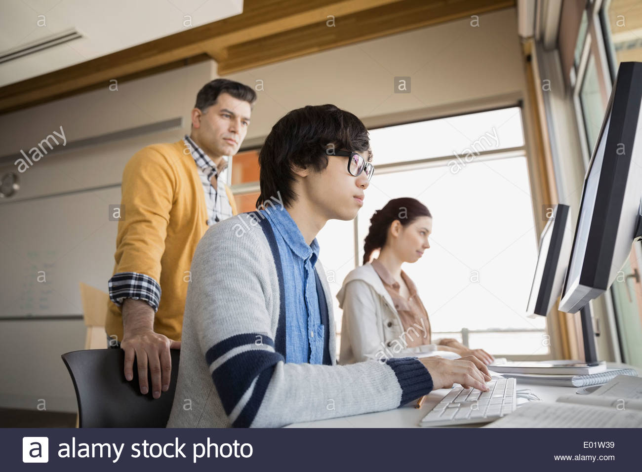 Side view teacher school boy hi-res stock photography and images - Alamy