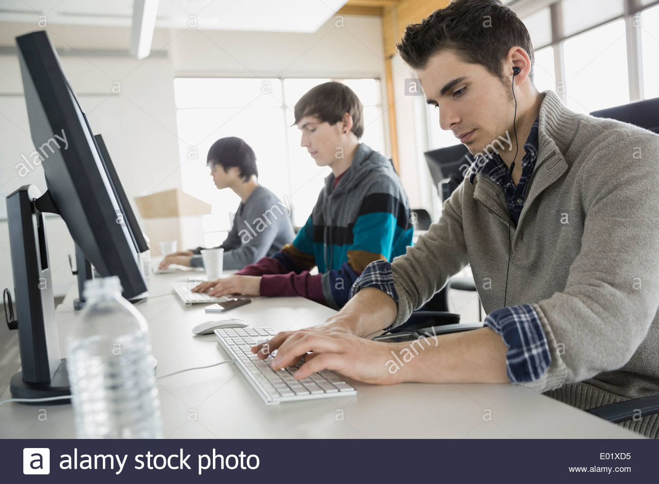 Student using headphone in classroom hi-res stock photography and ...