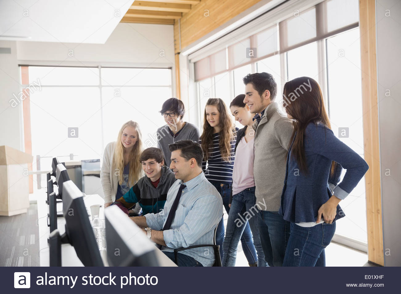 Indian teacher with students at computer hi-res stock photography and ...