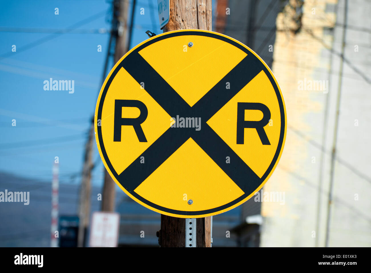 Railroad crossing road sign Stock Photo - Alamy