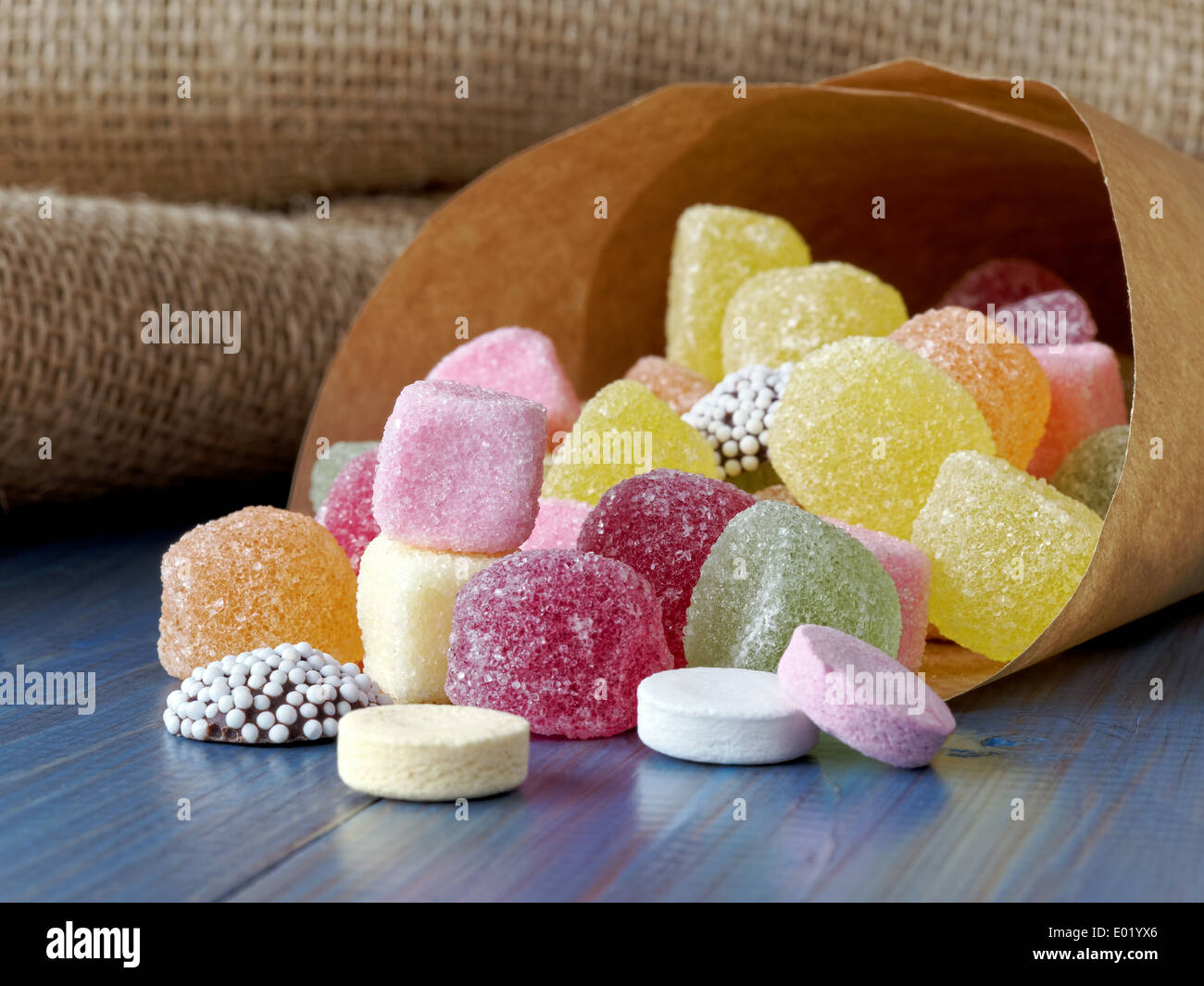 Paper bag filled with sugar candy sweets Stock Photo - Alamy