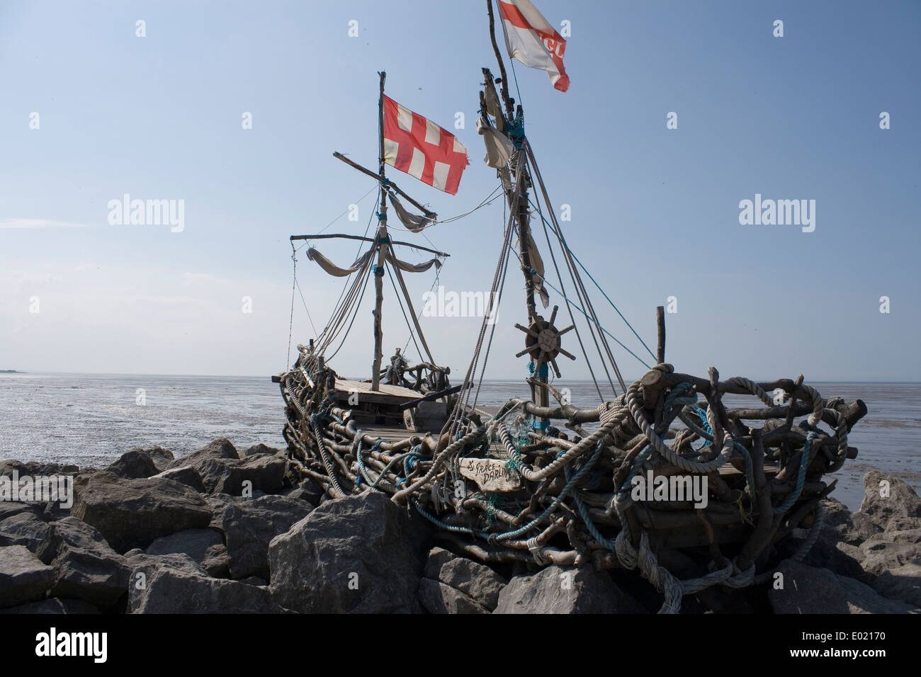 majestic shipwreck on some seaside rocks still proudly flying there ...