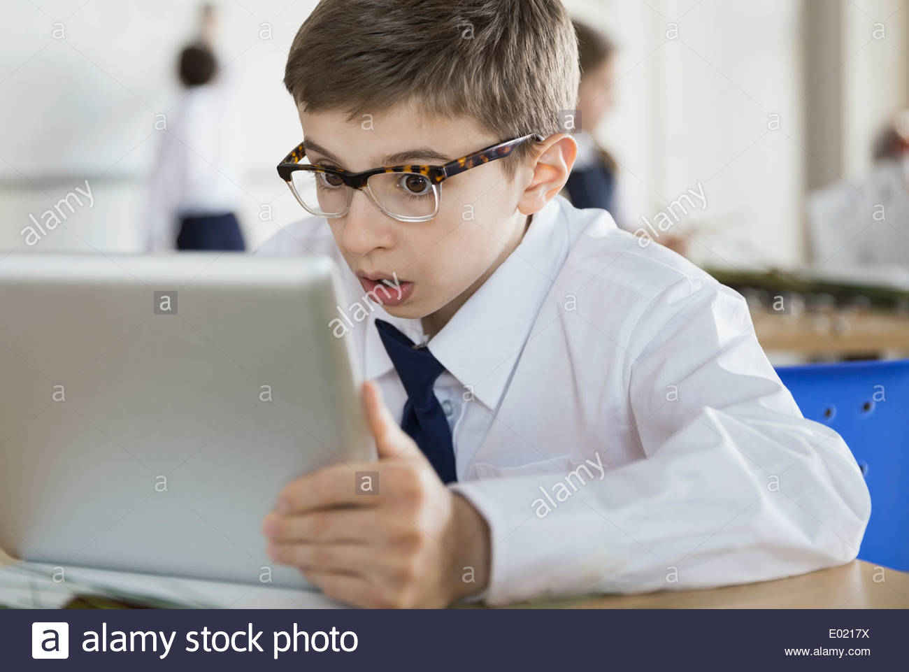 School uniform reading boy hi-res stock photography and images - Alamy