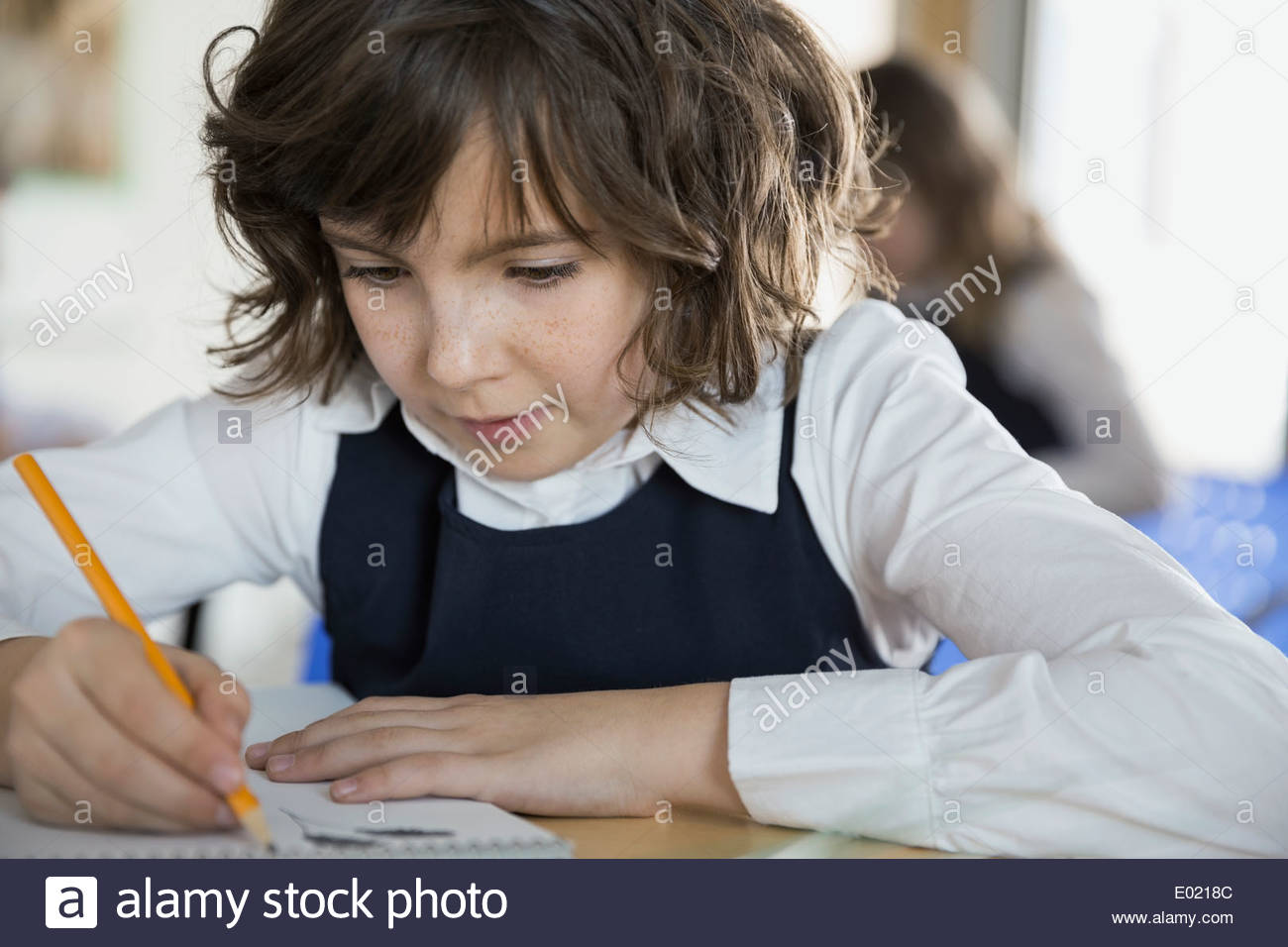 Close up of school girl doing homework Stock Photo - Alamy