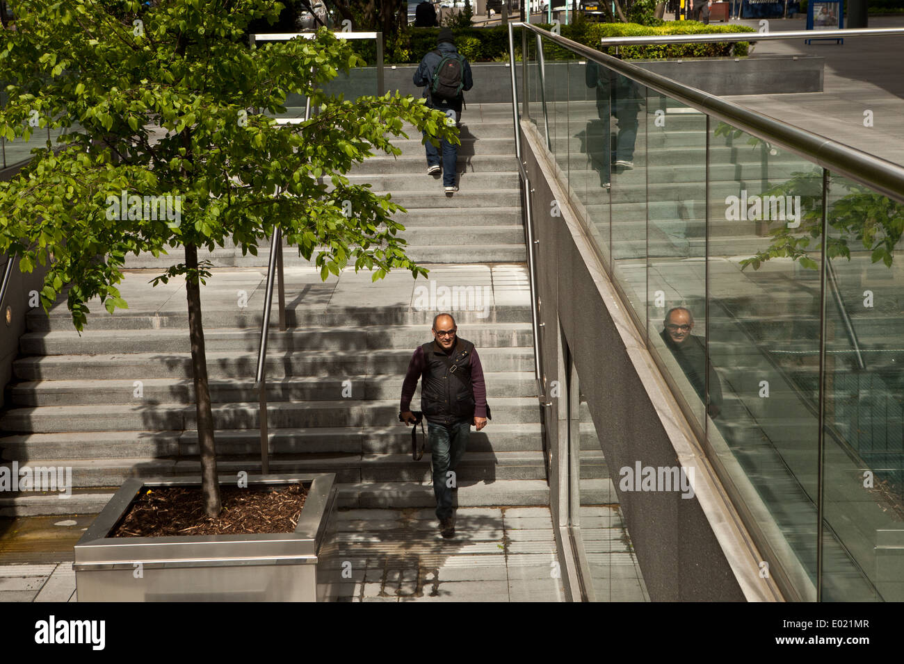 Man walking down steps hi-res stock photography and images - Alamy