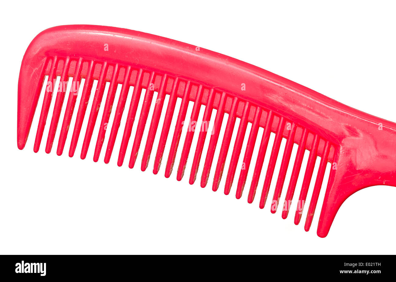 Red long toothed comb on a white background Stock Photo - Alamy
