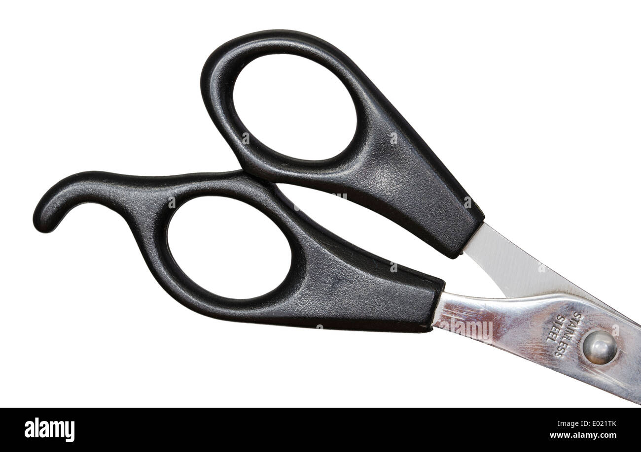 Closeup of the black handle of a pair of stainless steel scissors on a ...