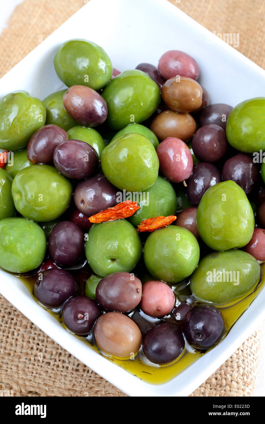 mix olives green and black with olive oil Stock Photo - Alamy