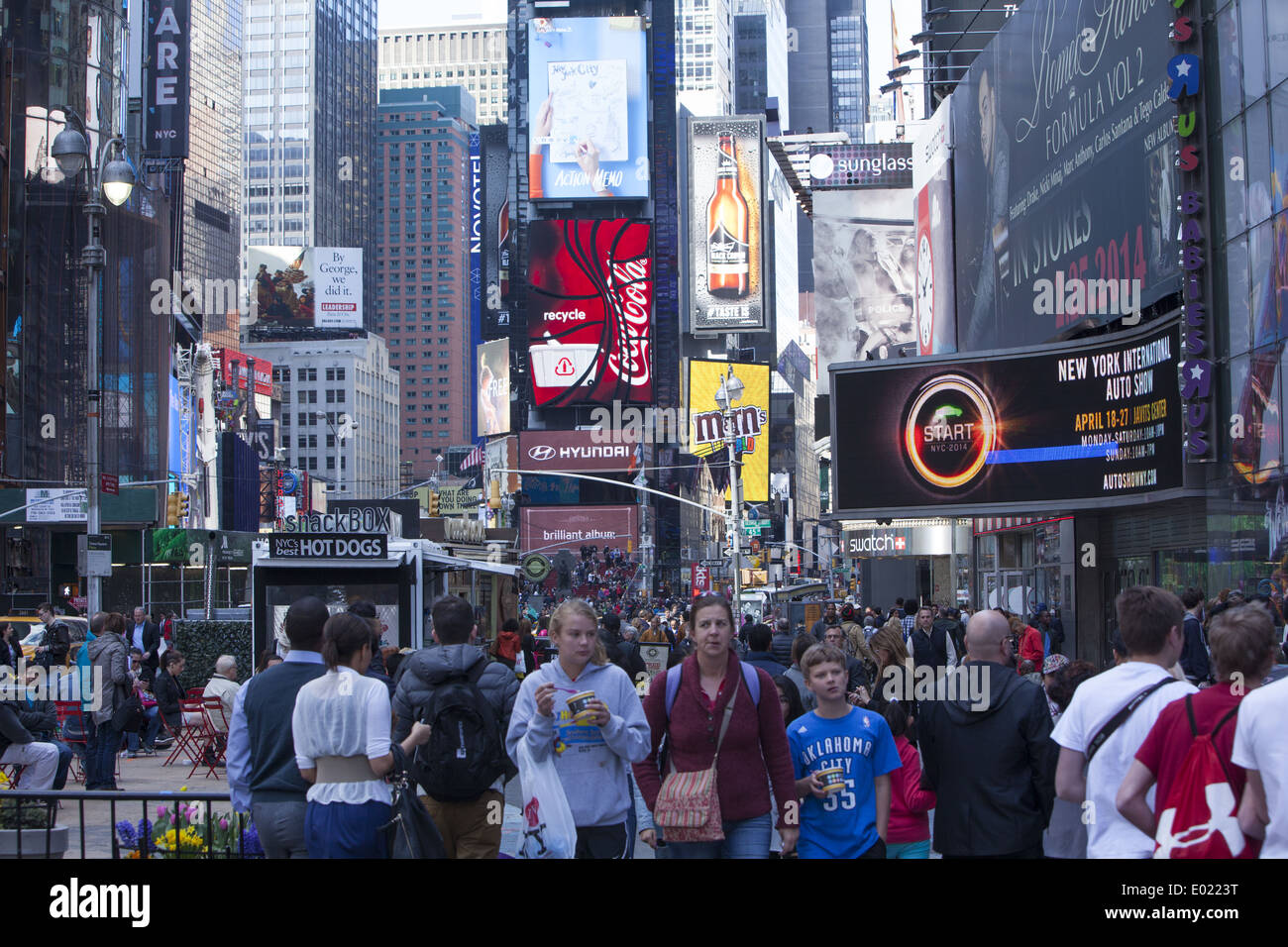 Mom and kids with crowds of others exploring the Times Square ...