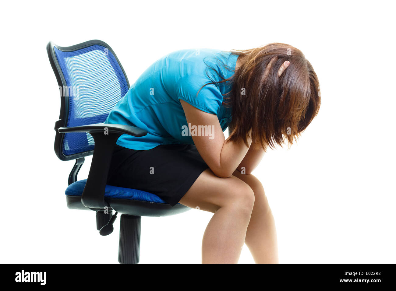 girl in despair on a chair on a white background Stock Photo - Alamy