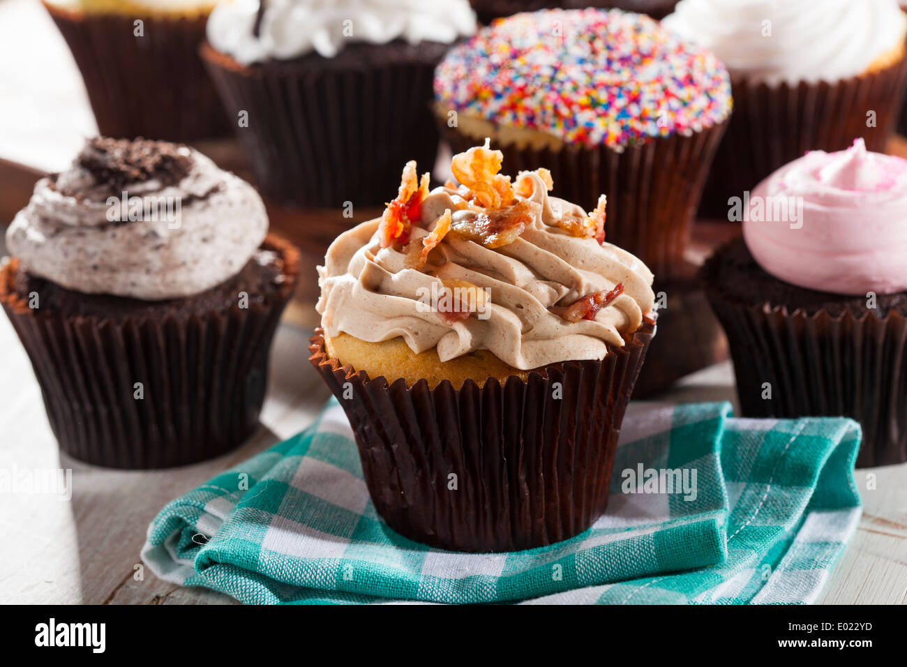Assorted Fancy Gourmet Cupcakes with Frosting on a Background Stock ...