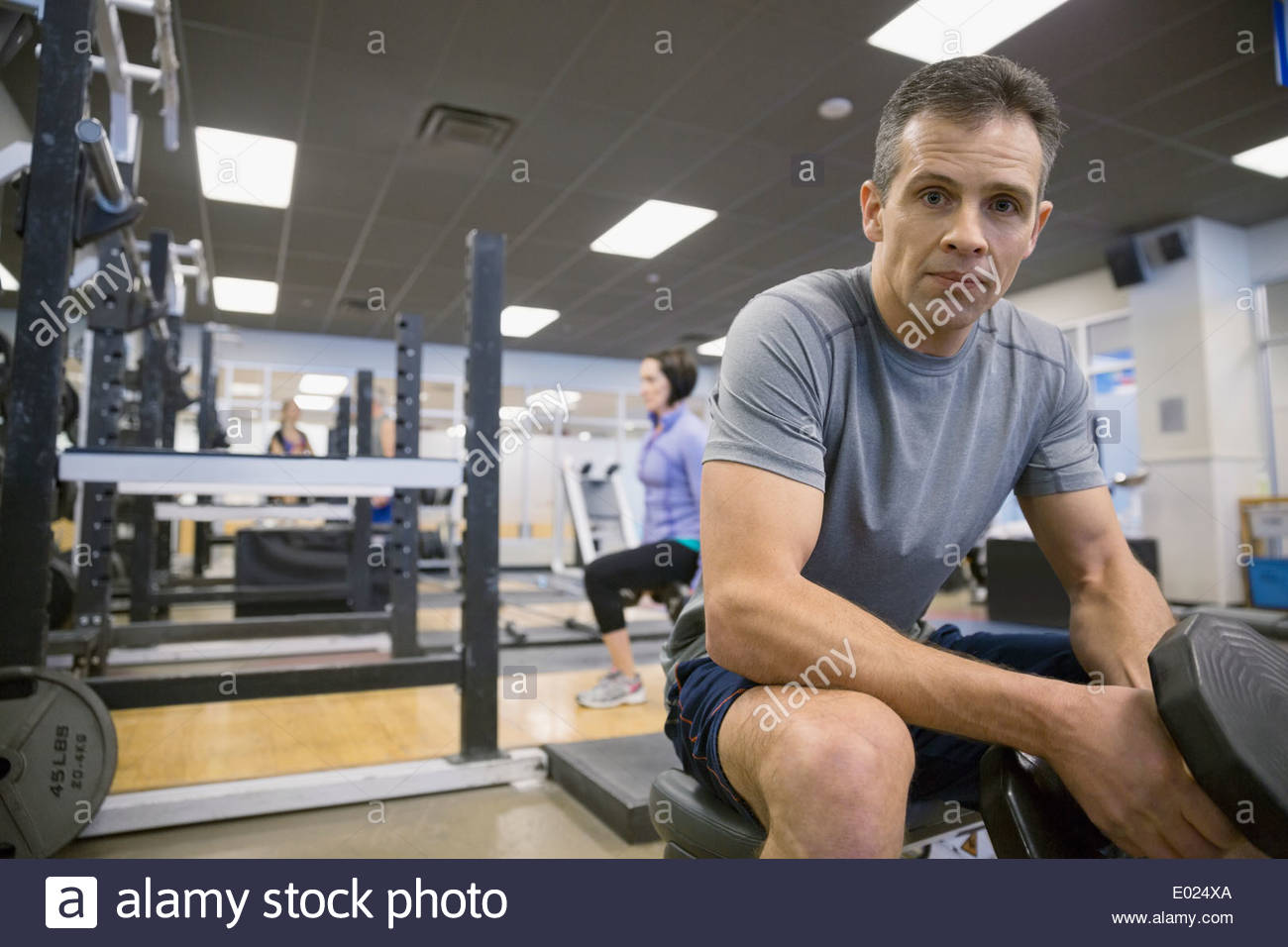 Man lifting dumbbell sitting on hi-res stock photography and images - Alamy