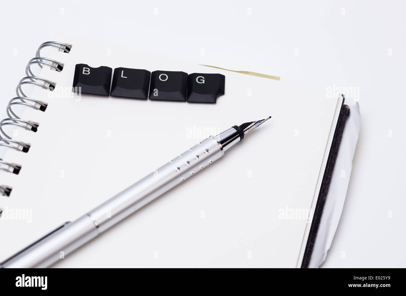 Notepad with pen Stock Photo - Alamy