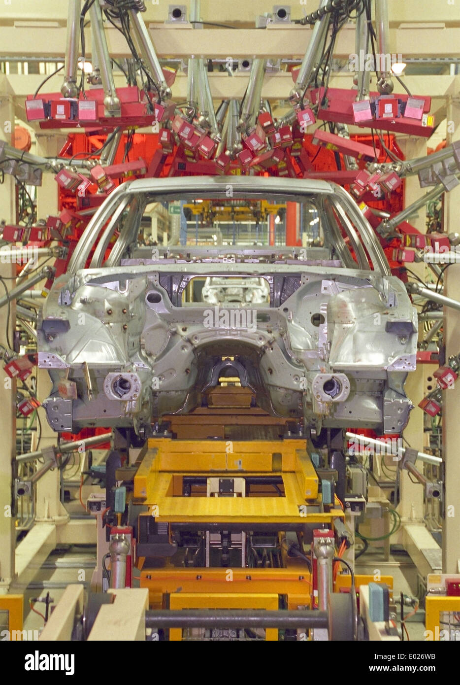 Laser equipped measuring devices are scanning an auto-body at a car ...